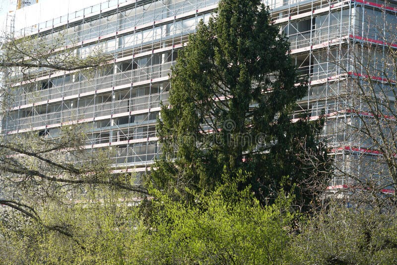 High Apartment House in Construction, Rough Building Covered by ...