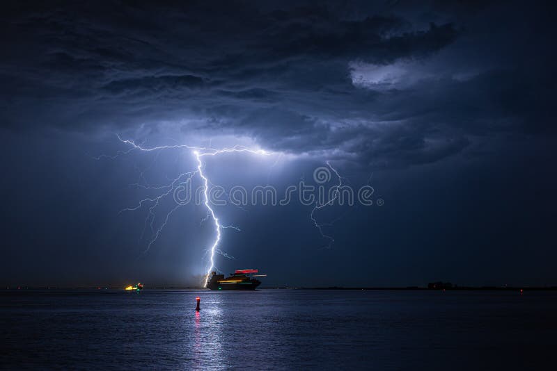 Ship Sails Across a River during a Severe Lightning Storm Stock Image ...