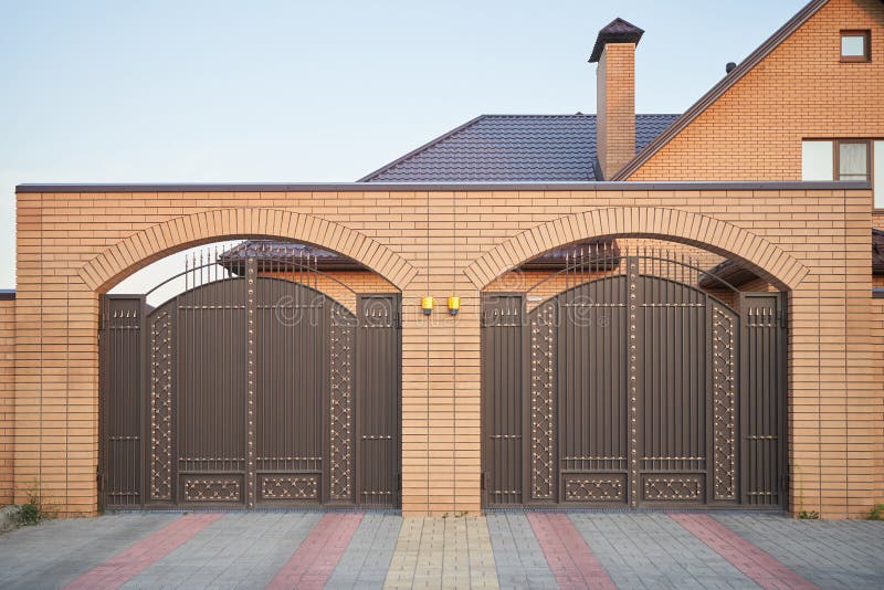 High Brick Fence and Two Metal Gates Stock Image - Image of doorway ...