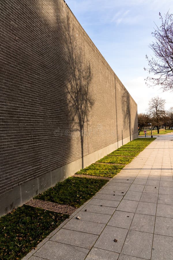 High Brick Wall with Shadows and Sidewalk Stock Image - Image of beauty ...