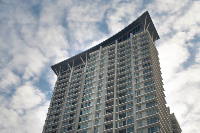 High Building Against Cloudy Sky Stock Photo - Image of immovable, high ...