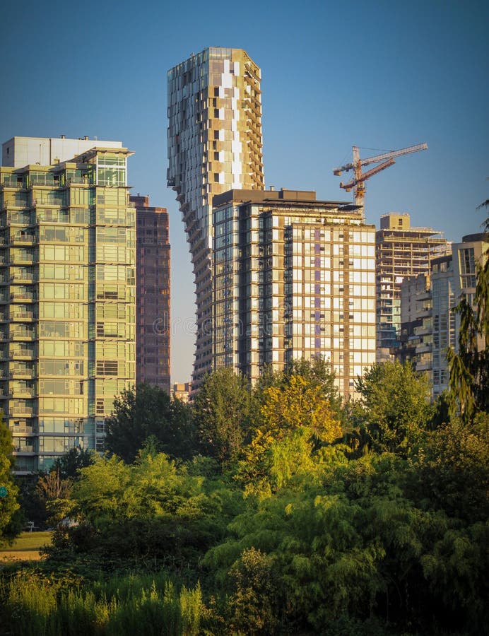 A High Building in Alberni Street with Green Trees Stock Photo - Image ...
