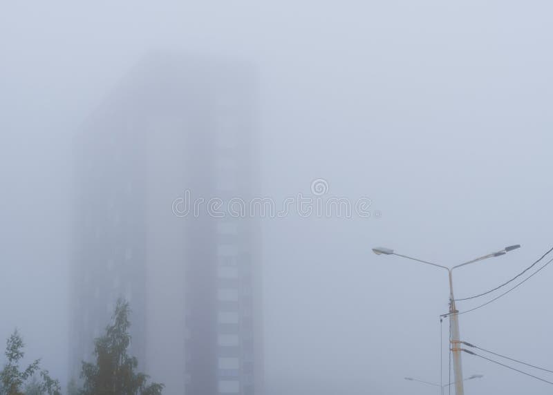 High Building in Dense White Fog in Summer Stock Photo - Image of ...