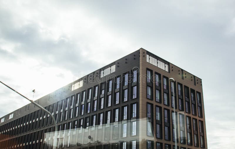 High Building. the Sky is Reflected in the Windows of a Tall House ...
