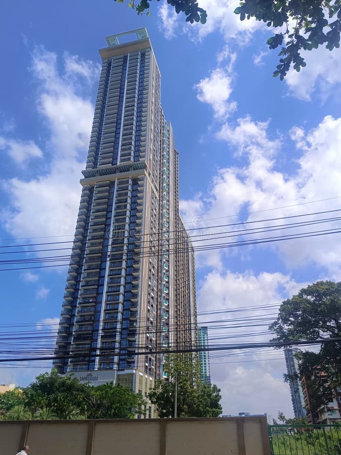 High Building Under Blue Sky with White Clouds Editorial Image - Image ...