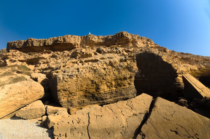 High Cliff in Morocco with Seldom Person on Its Edge Stock Image ...
