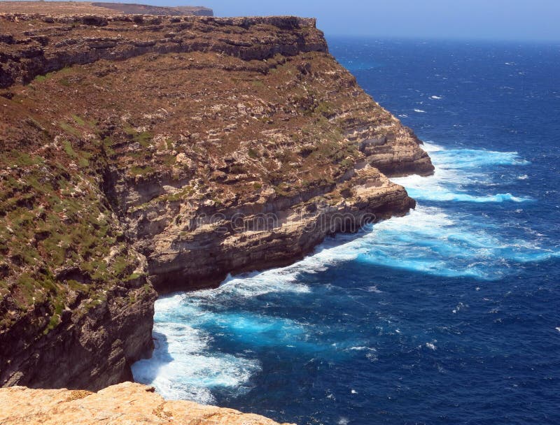 High cliffs and blue sea stock photo. Image of pano - 150587420