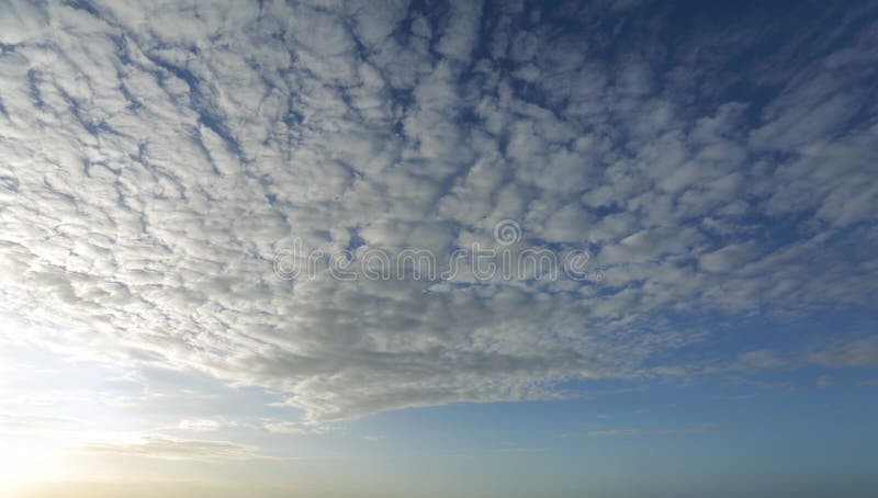 High Cloud with Light Coming from the Left of Image Stock Image - Image ...