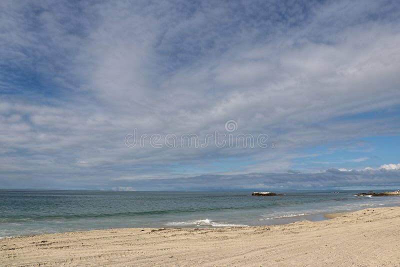 Cloudy Sky Over the Ocean and Sandy Beach Stock Photo - Image of ...