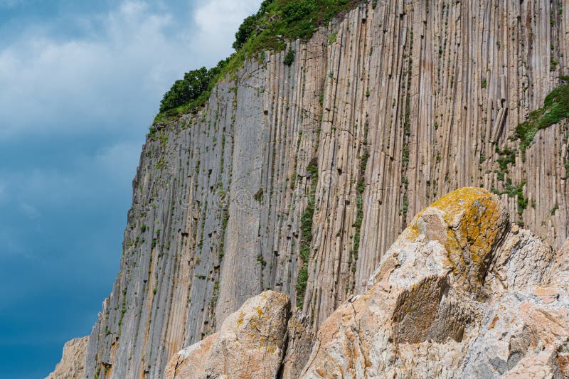 High Coastal Cliff Formed by Stone Columns, Cape Stolbchaty on the ...