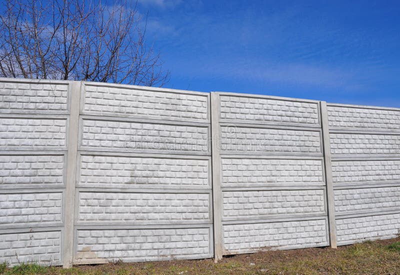Concrete Fence Panel Design on the Stone Fence Foundation Against Blue ...