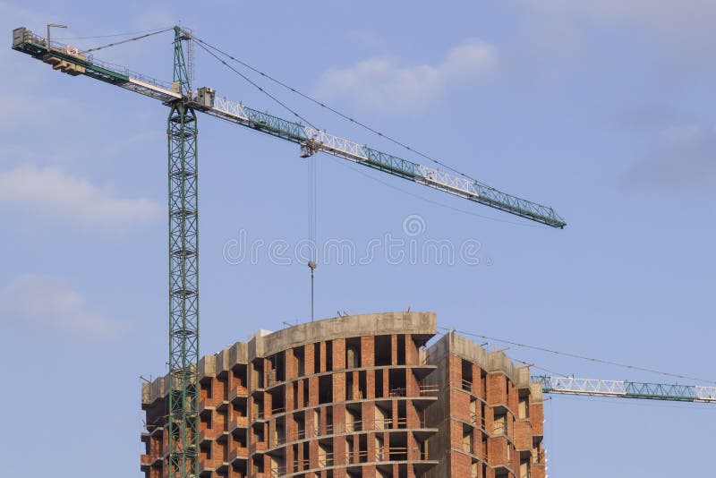 High Construction Cranes at a Construction Site Stock Image - Image of ...