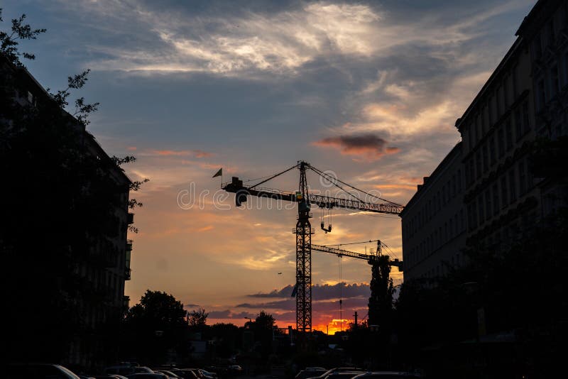 Construction Cranes at Sunset Stock Photo - Image of engineering ...