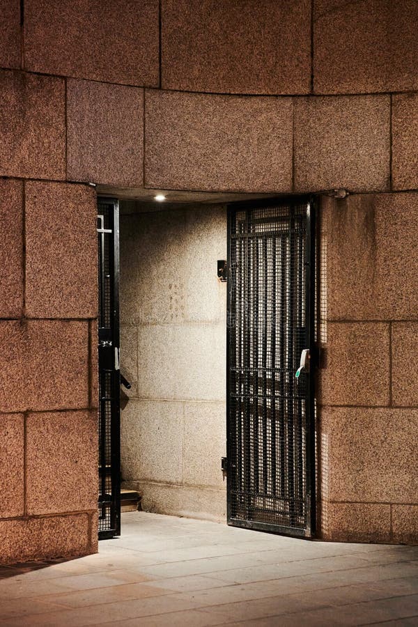 High Contrast Image of Black Metal Gateway in Marble Block Wall Stock ...