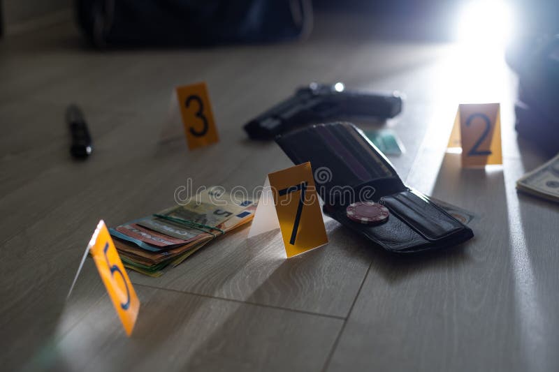 Evidence Markers with Knife and Magazine of Gun on the Ground. Sign of ...