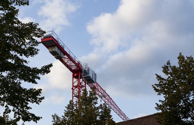 Crane crane over the house editorial photography. Image of building ...