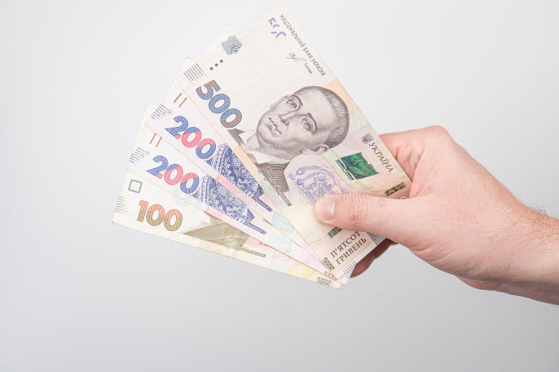 High Denomination Banknotes 100, 200 in a Hand, Possibly Being ...