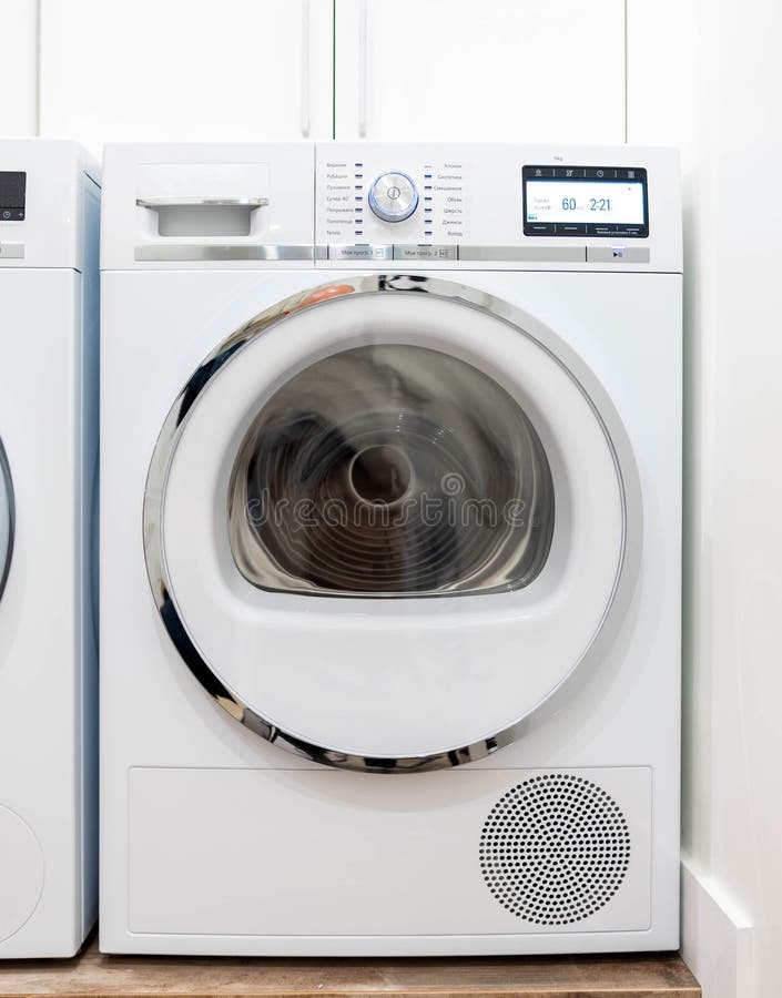 A High-efficiency Front-loading Dryer Machine in a Sleek Laundry Room ...