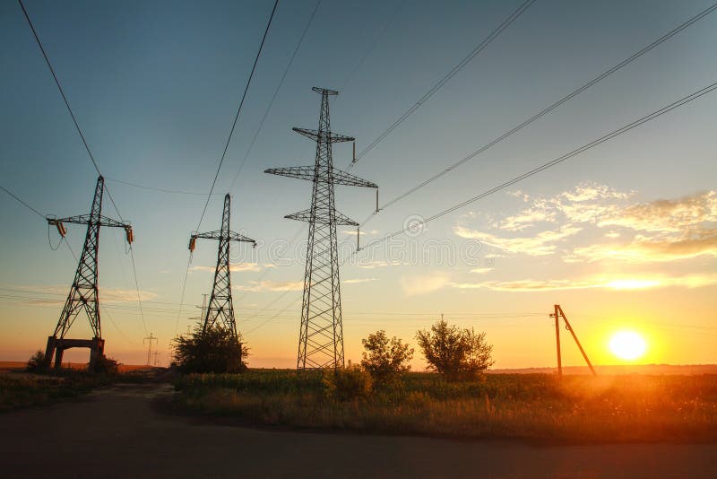 High Electricity Power Line Towers at Dramatic Sunset Stock Photo ...