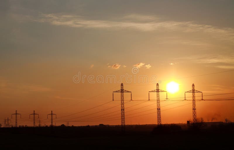 High Electricity Power Line Towers at Dramatic Sunset Stock Image ...