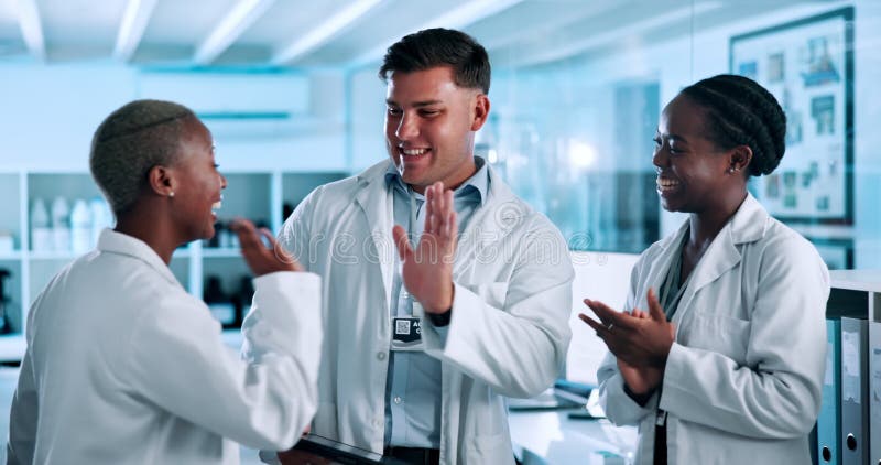 High Five, Celebration and Scientists with Tablet in Laboratory Excited ...