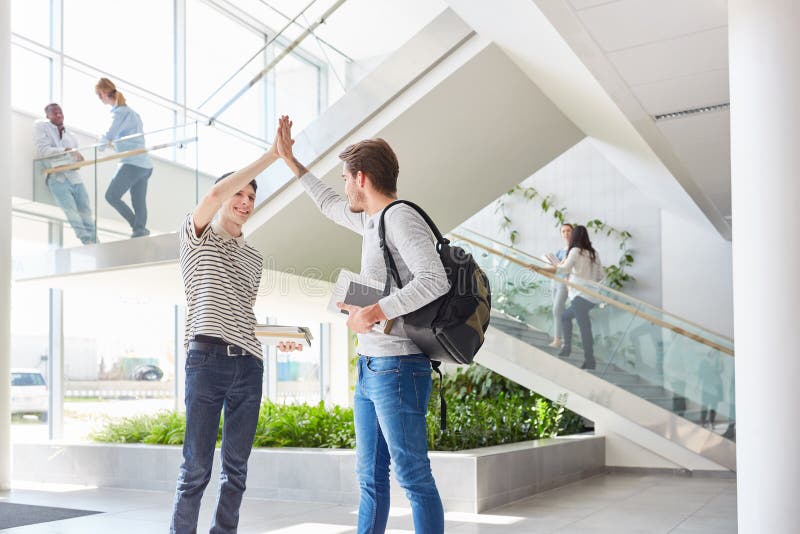 High Five between Two Students Stock Photo - Image of freshman, applied ...