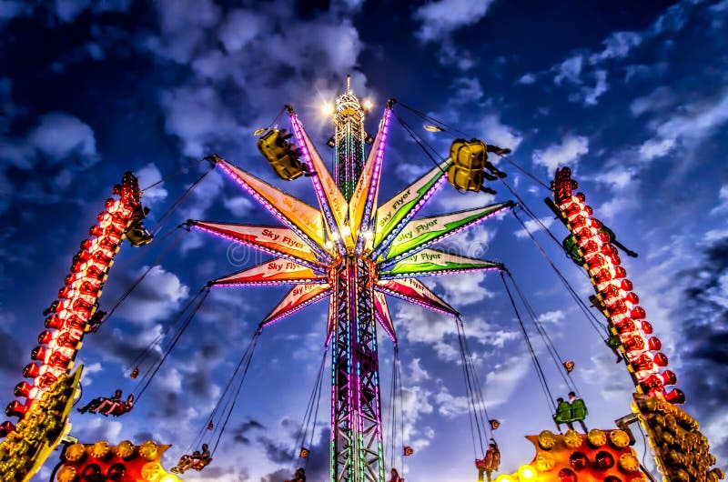 High Flying editorial image. Image of amusement, blue - 62949950