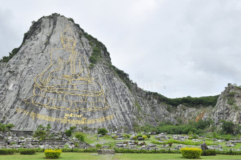 High Golden Buddha Laser Carved on the Mountain Stock Image - Image of ...