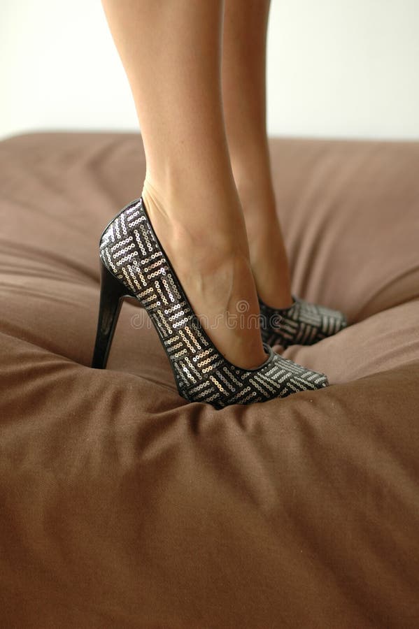 High heels on a sofa stock photo. Image of sofa, sequin - 12041520
