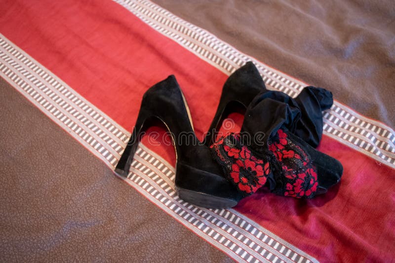 High Heels and Stockings on the Ceiling of a Bed Stock Image - Image of ...