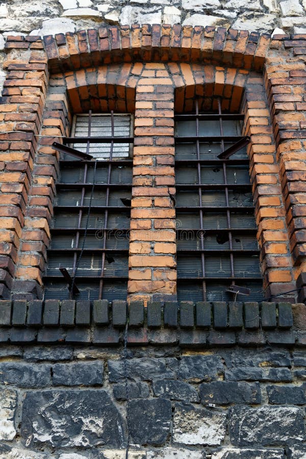 High Industrial Double Window, Barred, in Brick Wall Stock Image ...