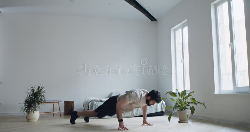 Young Man Practicing Burpee Exercise at Home Stock Footage - Video of ...
