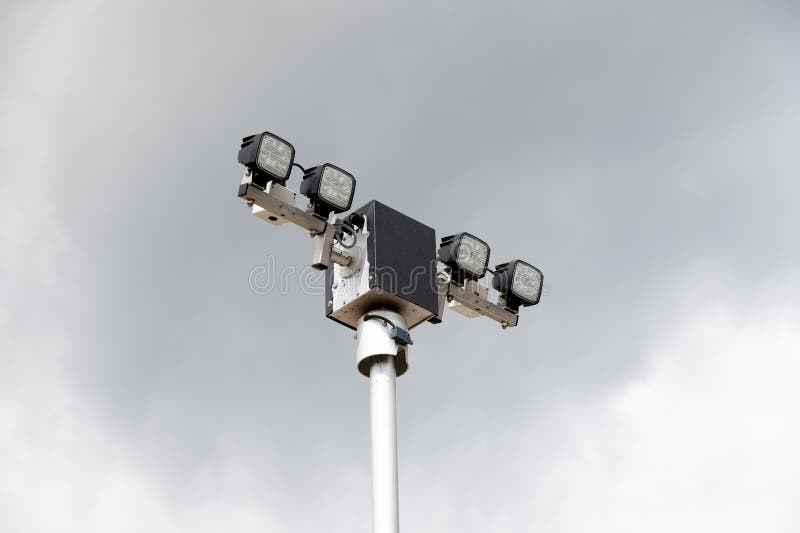 High-Intensity Security Lights Against Overcast Sky Stock Photo - Image ...