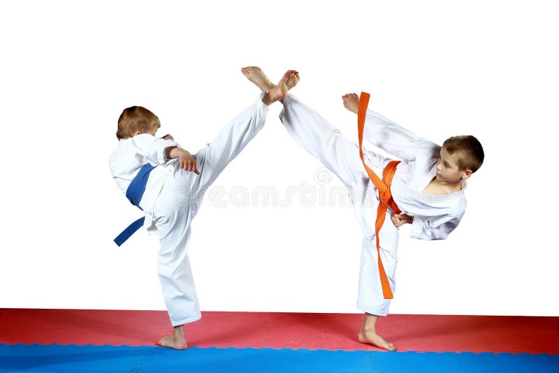High Kicks Legs Two Athletes are Training on the Red and Blue Mat Stock ...