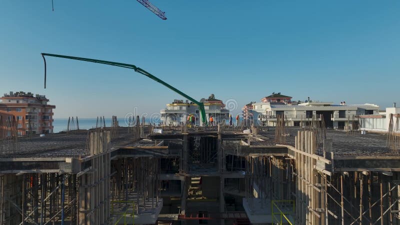 Aerial Video: Concrete Pouring in Progress on the Highest Floors of a ...