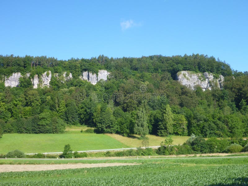 High Limestone Cliff in a Green Landscape Stock Image - Image of rocky ...