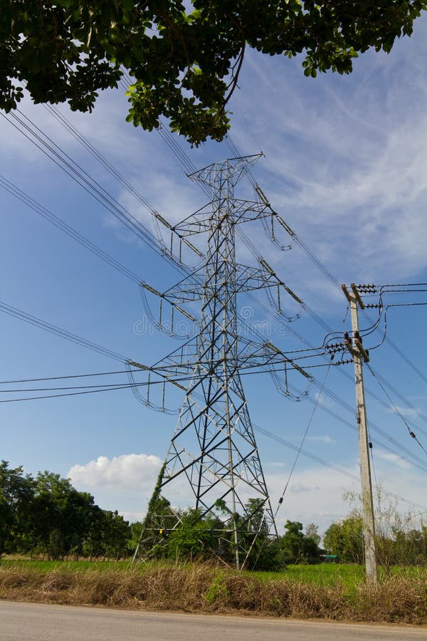 High and Low Voltage Power Poles Near Each Other. Stock Image - Image ...