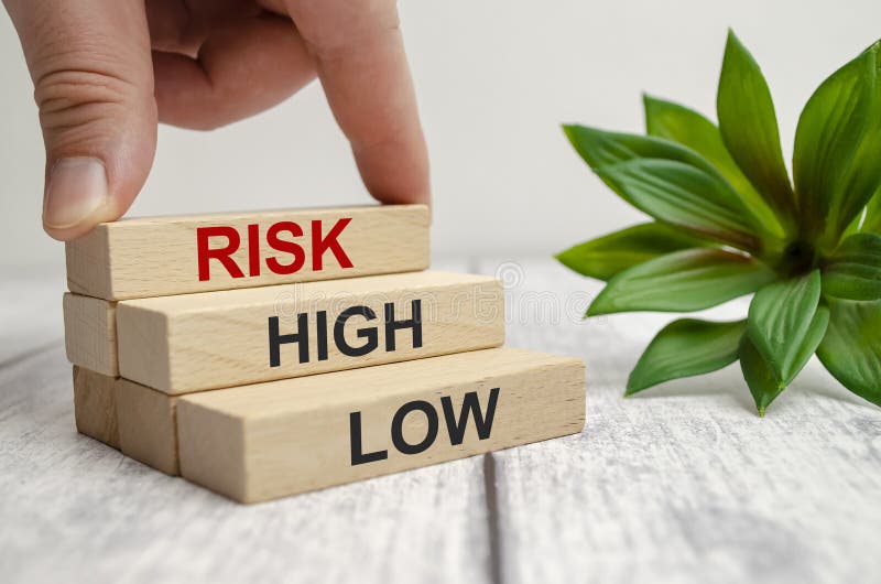 HIGH and LOW; Wooden Blocks with HIGH LOW Text of Concept Stock Photo ...