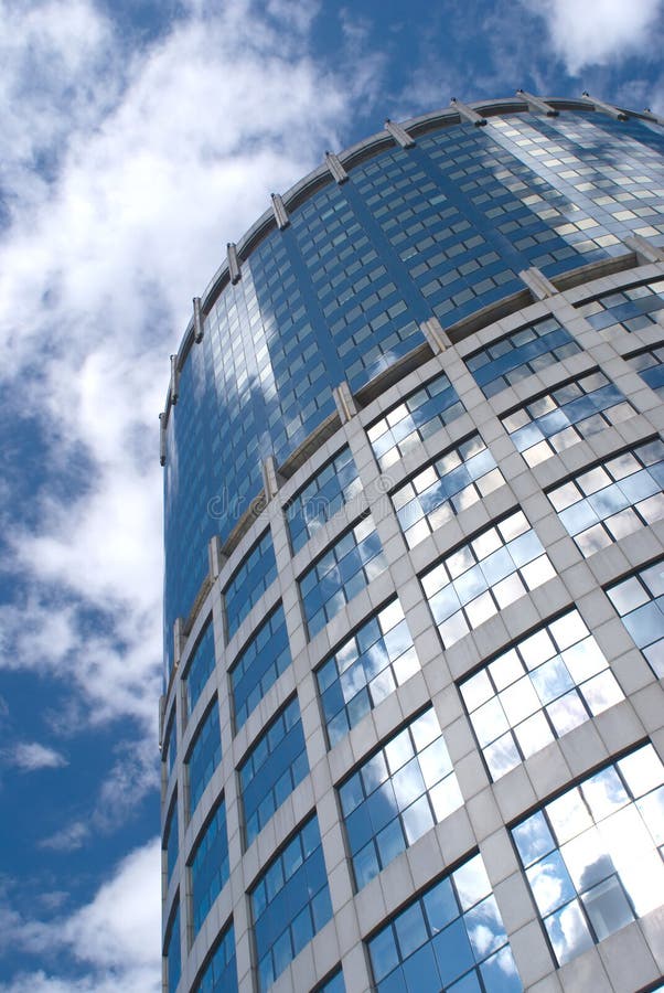 Modern Office Round Tower Building Over Cloudy Sky Stock Image - Image ...