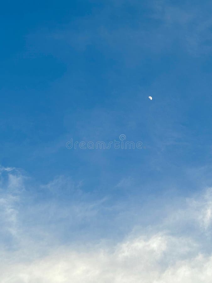 High Moon in the Bright Blue Sky with Little Clouds Stock Photo - Image ...