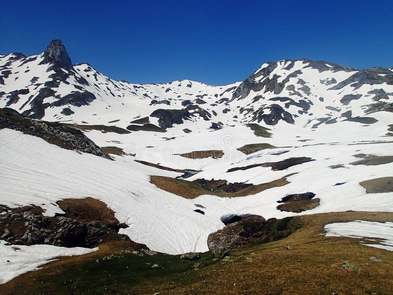 High Mountains of the Pyrenees, with Meadows Still Snowed in Summer and ...