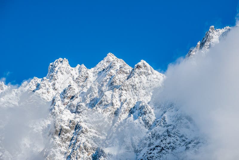 High mountains in the snow stock photo. Image of extreme - 165570216