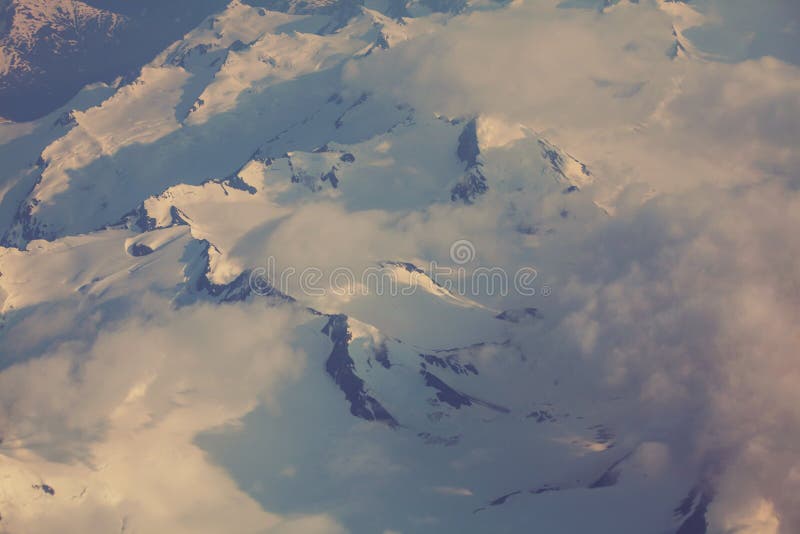 Above mountains stock photo. Image of cold, butty, grassy - 166453794