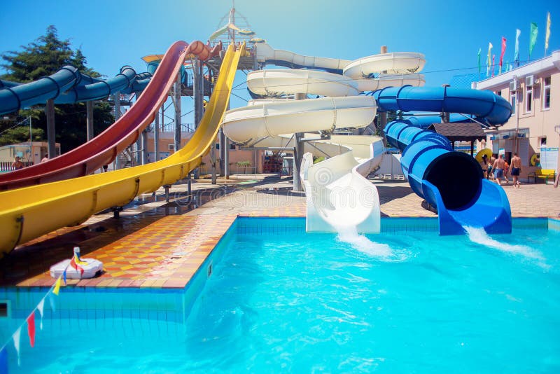 High Multi-colored Plastic Slides in the Form of Swirling Pipes in the ...