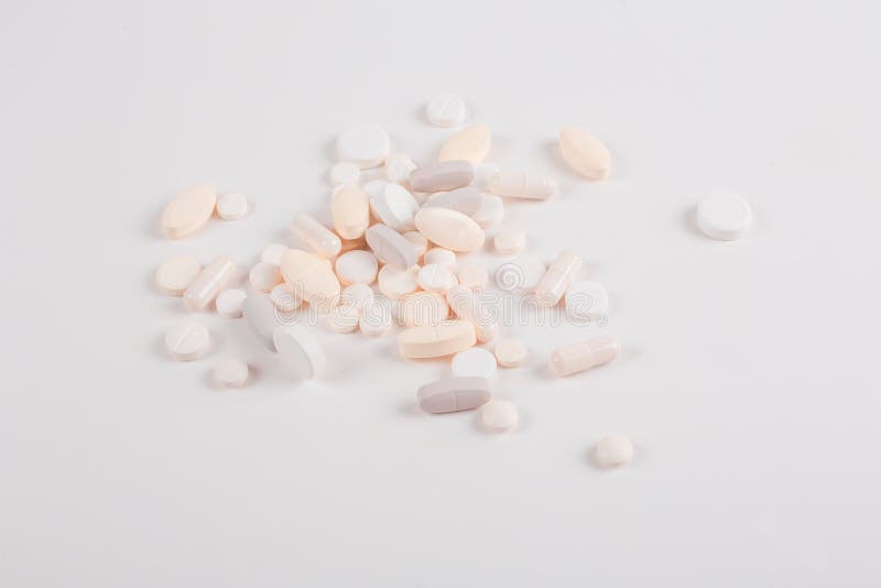 High Number of Pills on White Background Surface. High Resolution Image ...