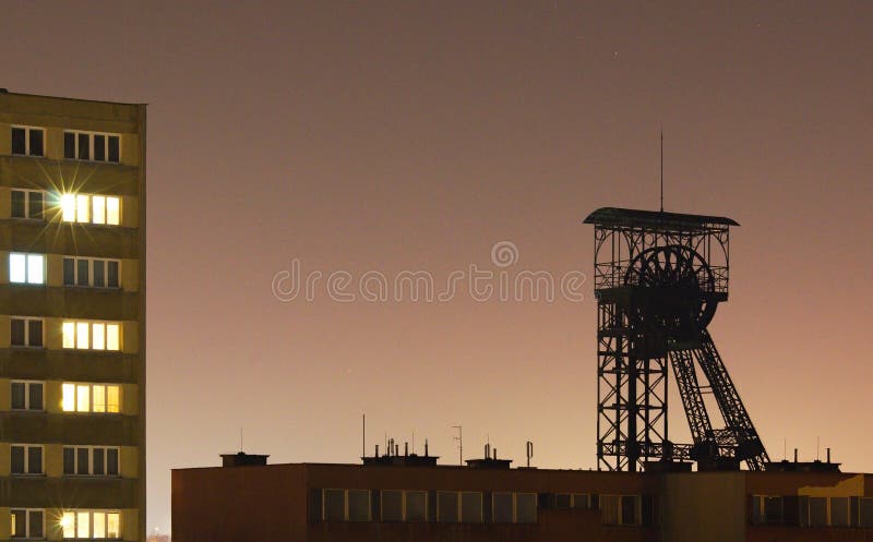 High Old Drilling Rig in Center of Night City Stock Photo - Image of ...
