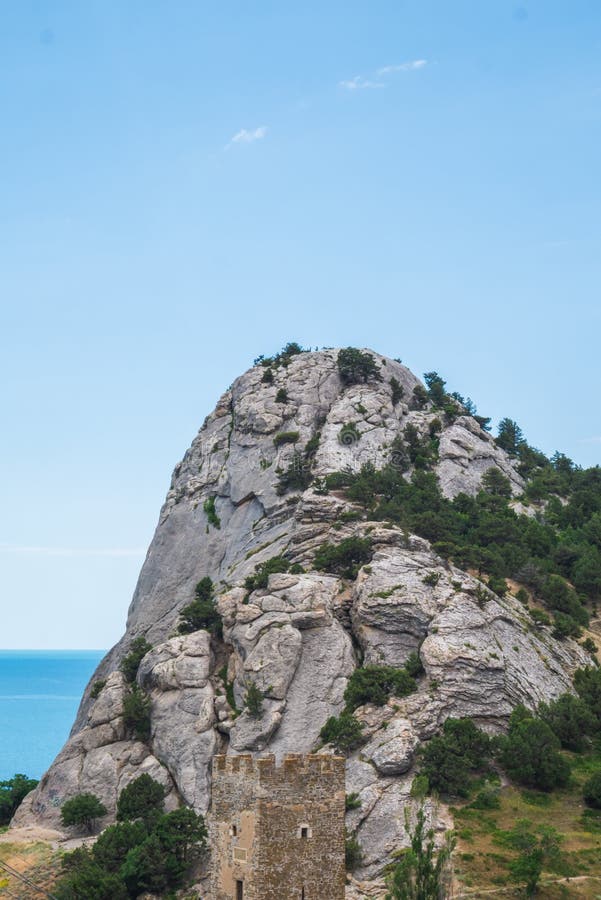 High Peak of the Mountain in the Middle of the Sea Stock Image - Image ...