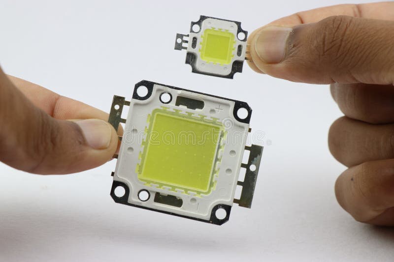 High Power Light Emitting Diode Chips of Various Size Held in the Hand ...