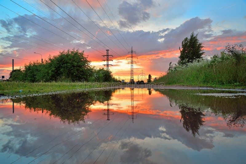High-power Line - Power Lines are Reflected in a Puddle after Th Stock ...