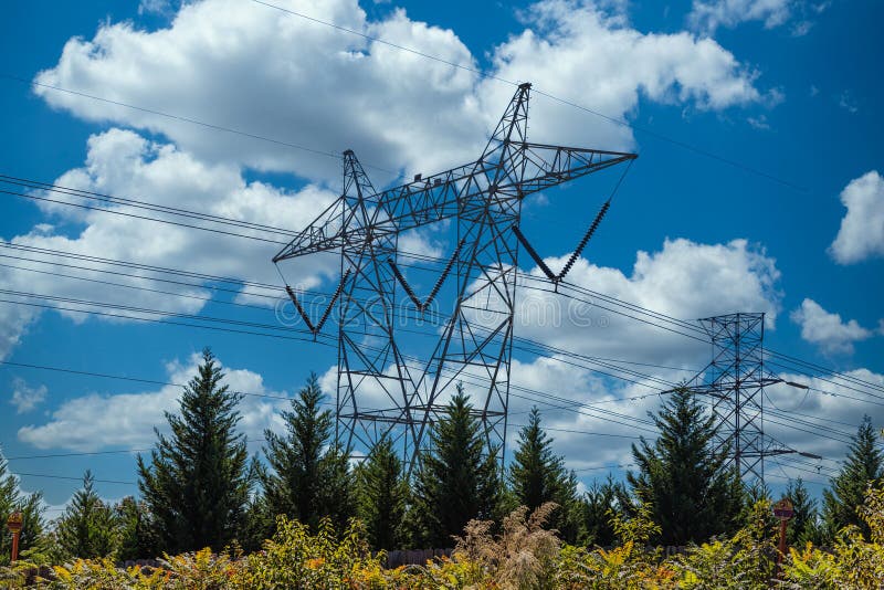 High Power Lines Over Trees Stock Photo - Image of blue, pole: 180376944